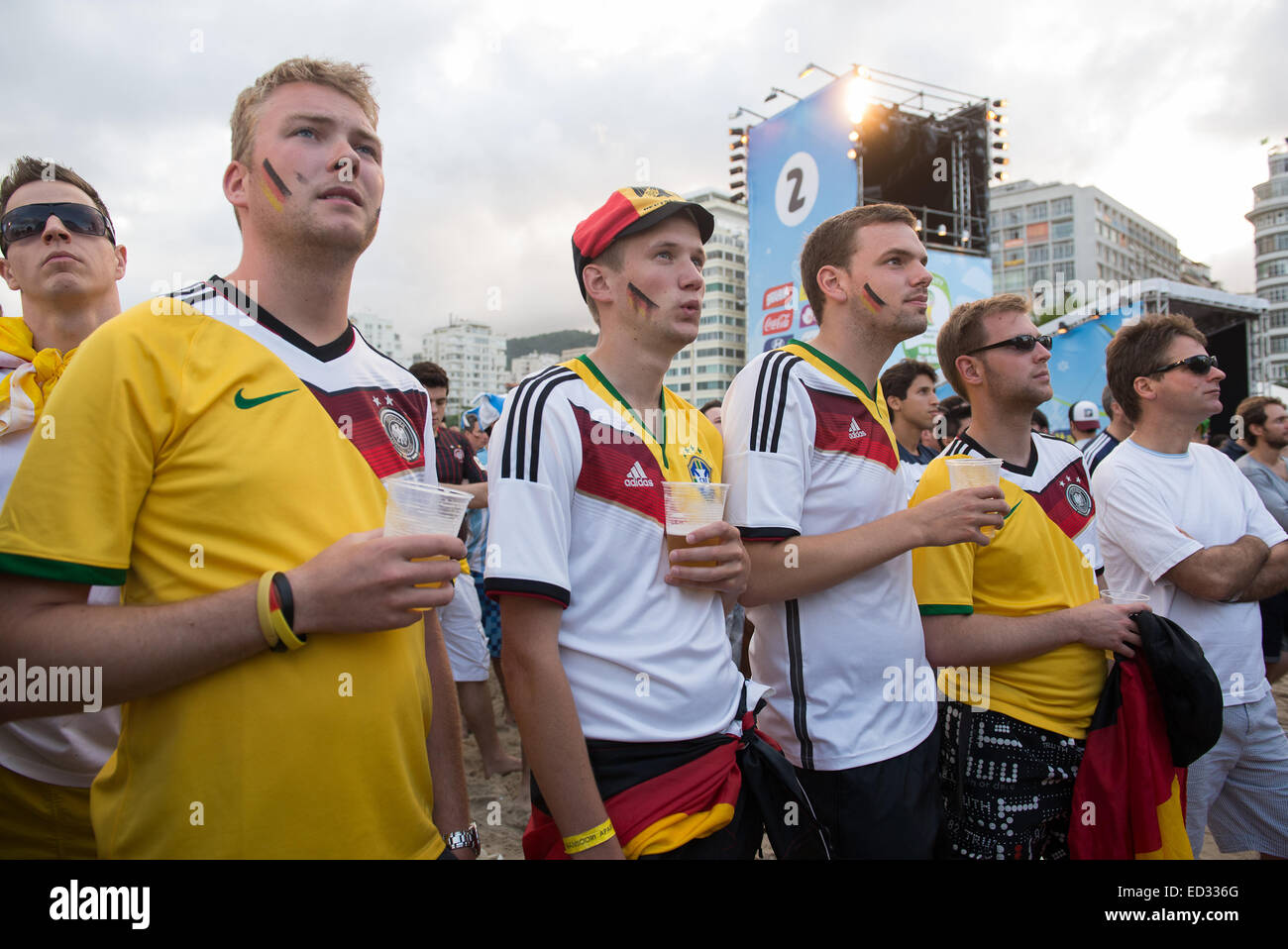 Fans at FIFA Fan Fest Rio de Janeiro watch the televised Group G match ...