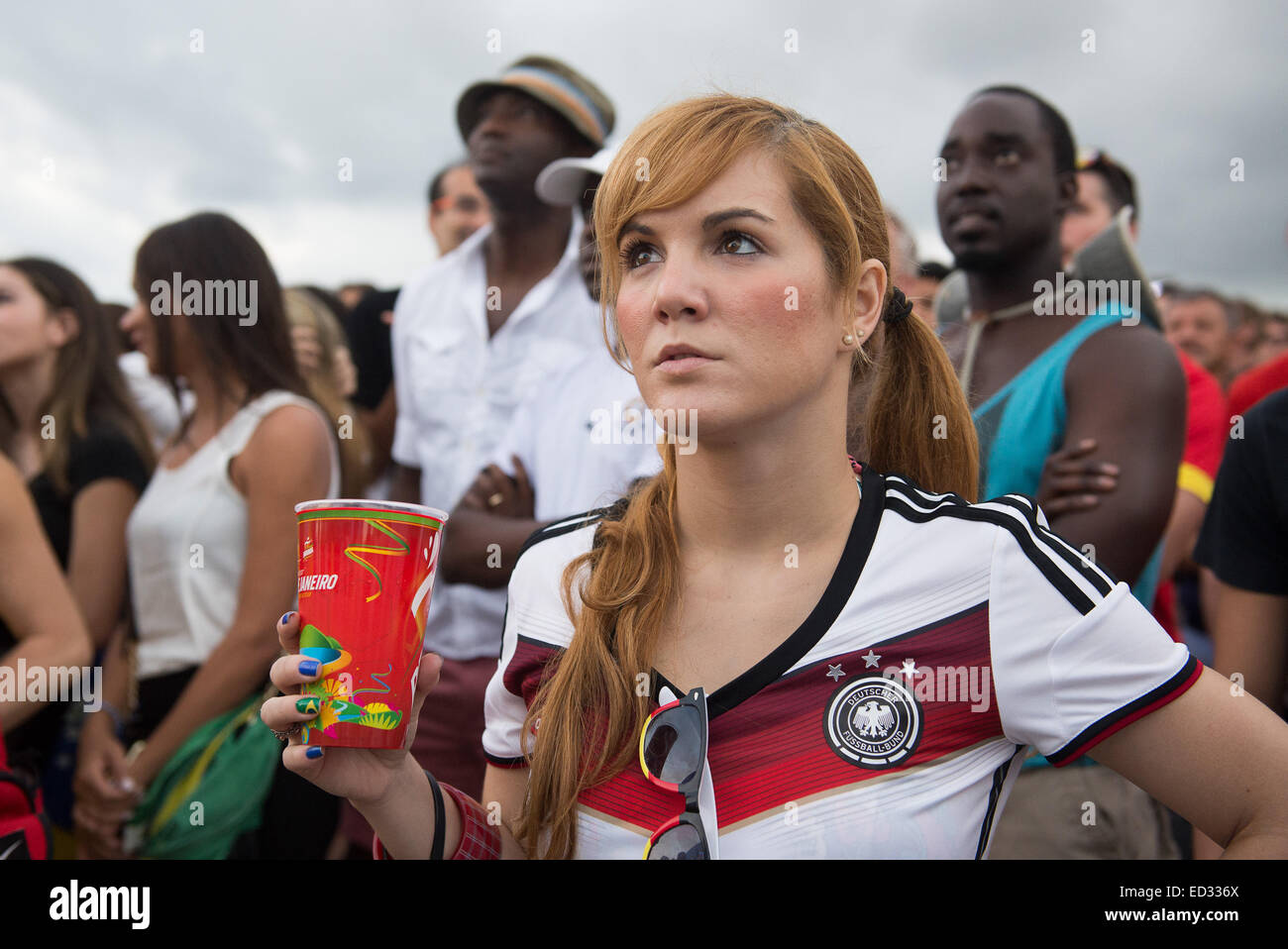 Fans at FIFA Fan Fest Rio de Janeiro watch the televised Group G match ...