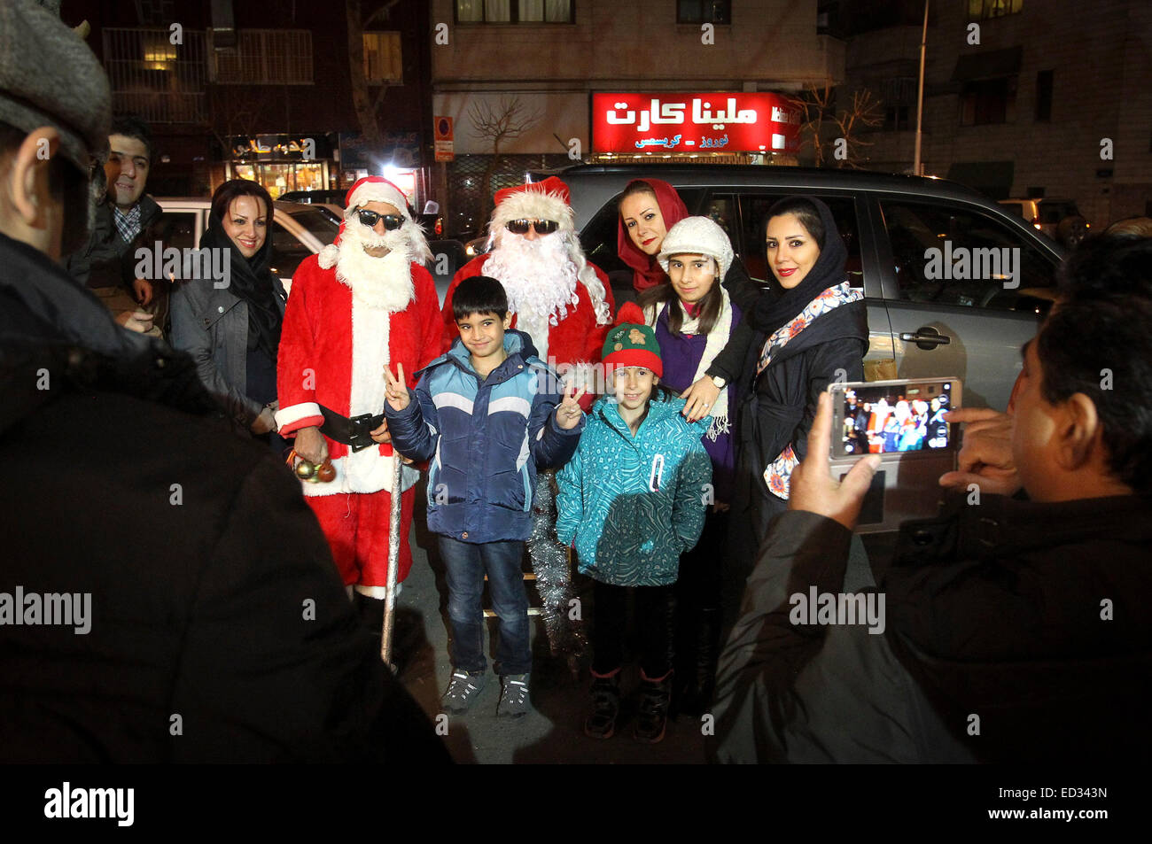 Tehran, Iran. 24th Dec, 2014. Members of an Iranian family pose for ...