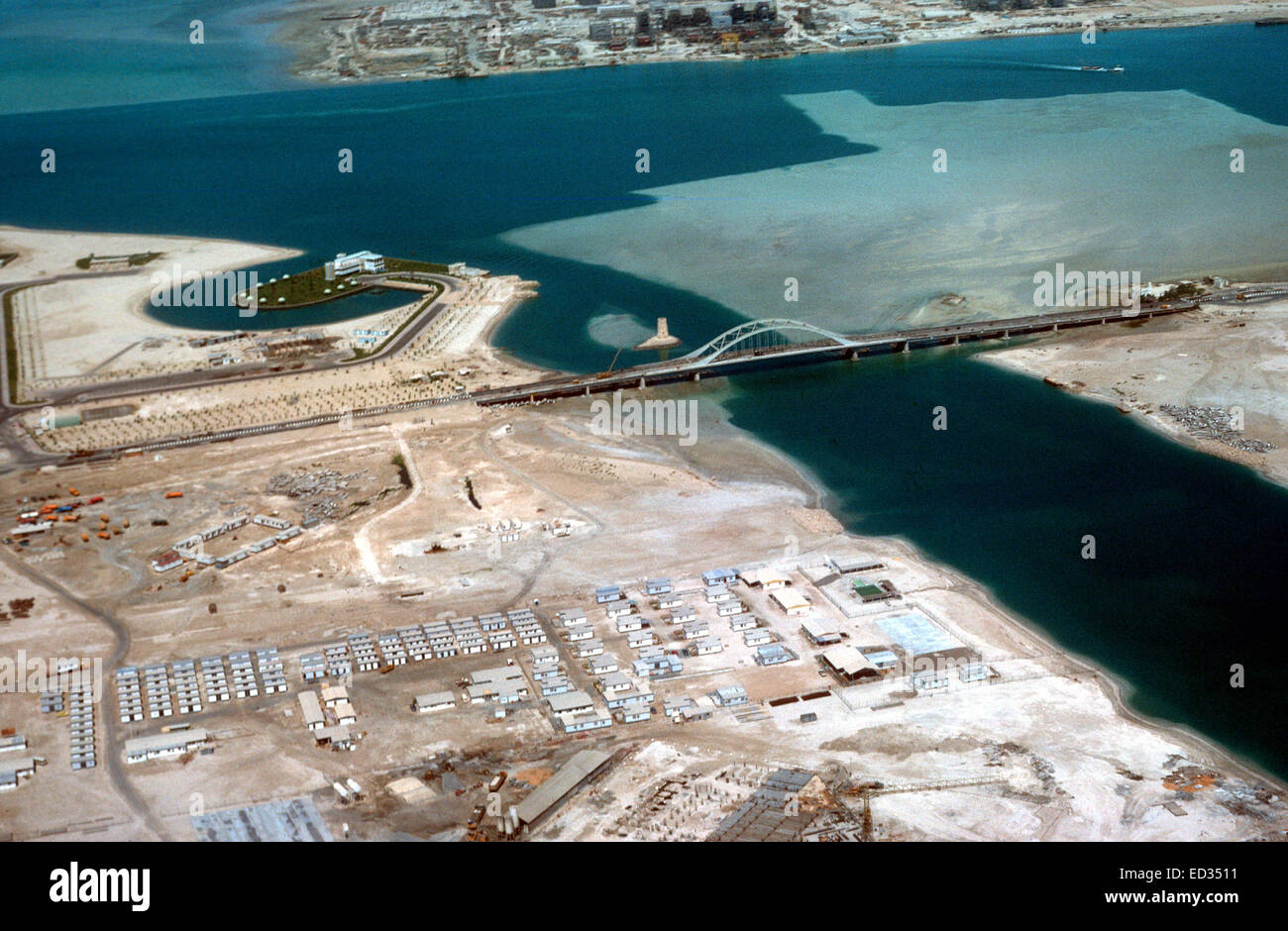 Aerial view of Abu Dhabi with al-Maqta bridge to mainland taken in 1975 ...
