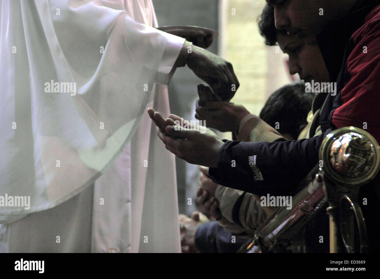 Christian devotee receive communion during the final dawn mass on ...