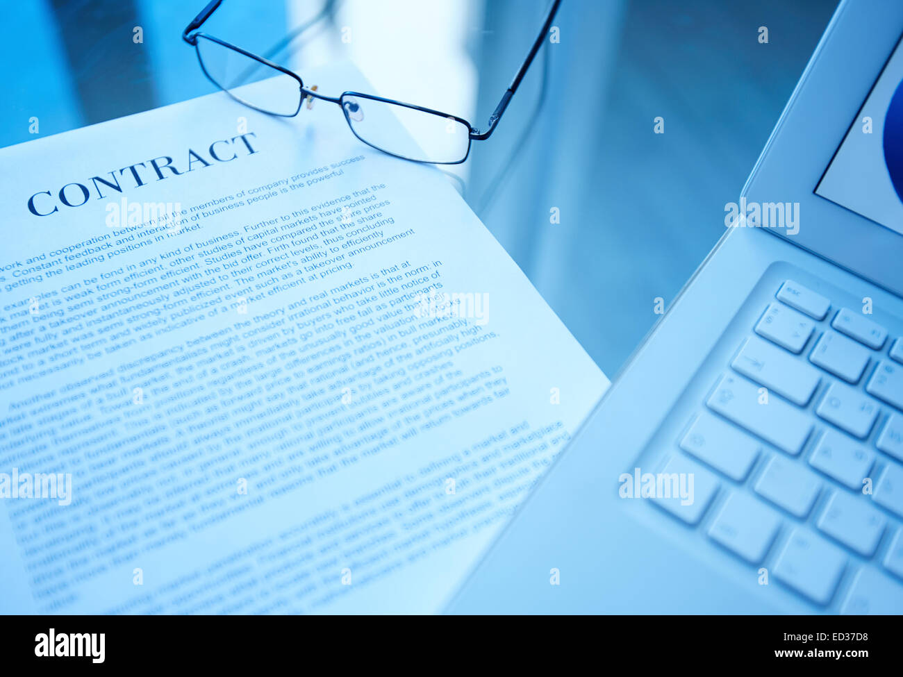 Contract, eyeglasses and laptop keypad Stock Photo - Alamy
