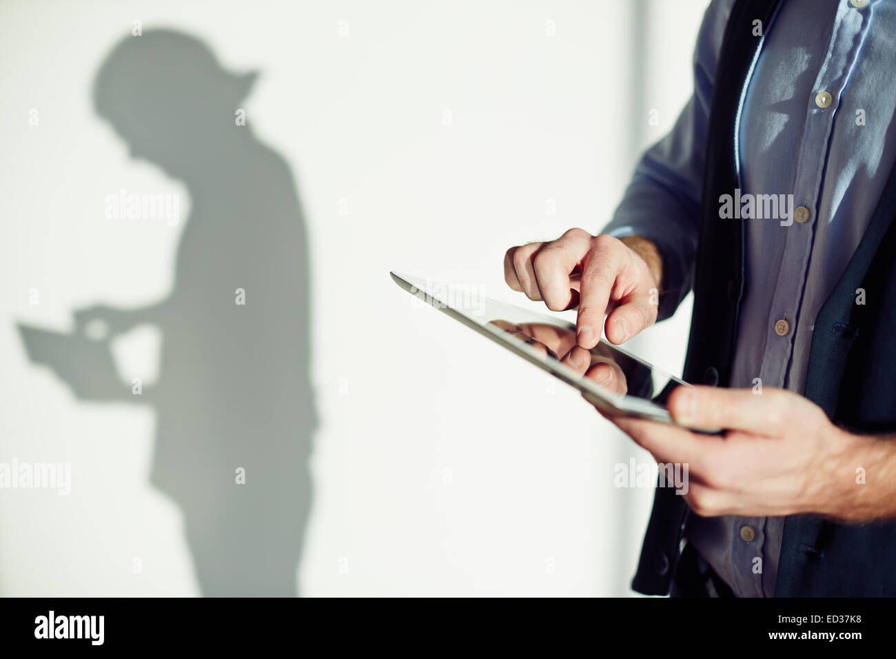 Male hands during networking in digital tablet Stock Photo - Alamy
