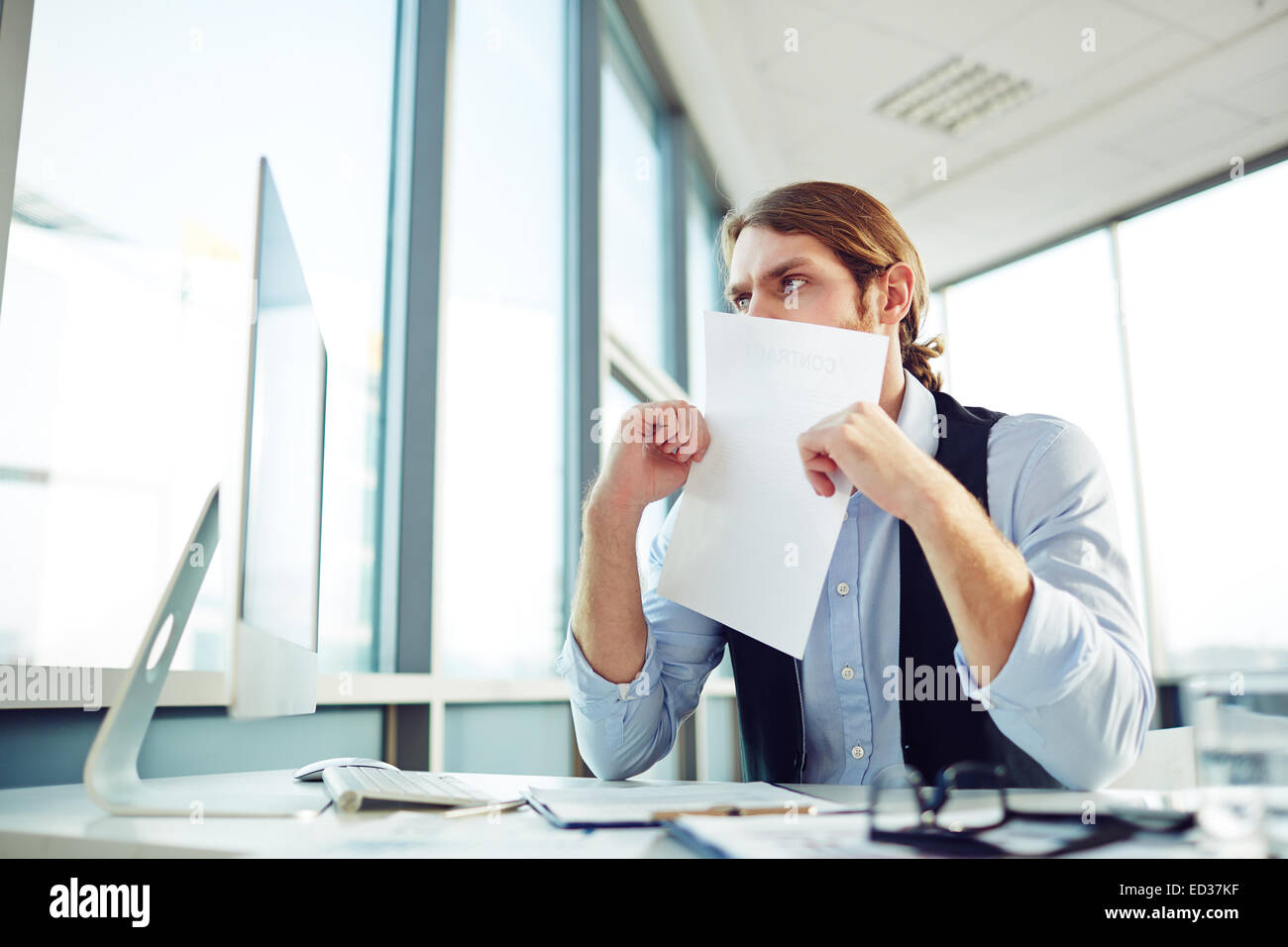 Man computer looking monitor confused hi-res stock photography and ...