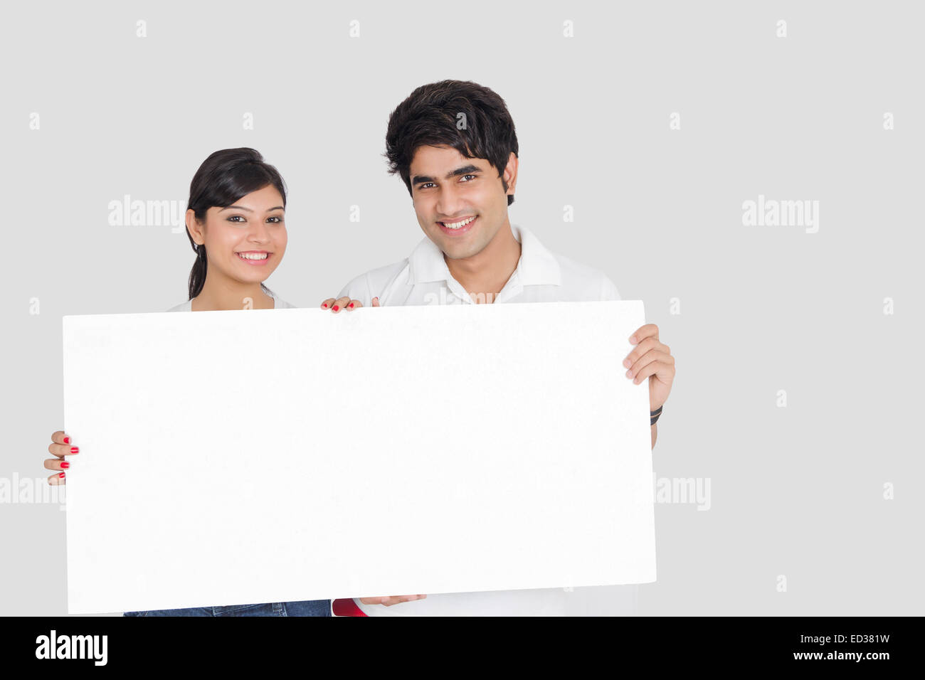 indian couple showing Message Board Stock Photo - Alamy