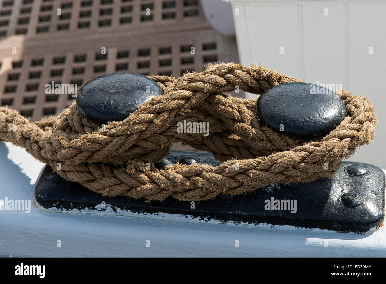 Closeup on mooring line on a mooring bitt. Shot from an old sailing ...