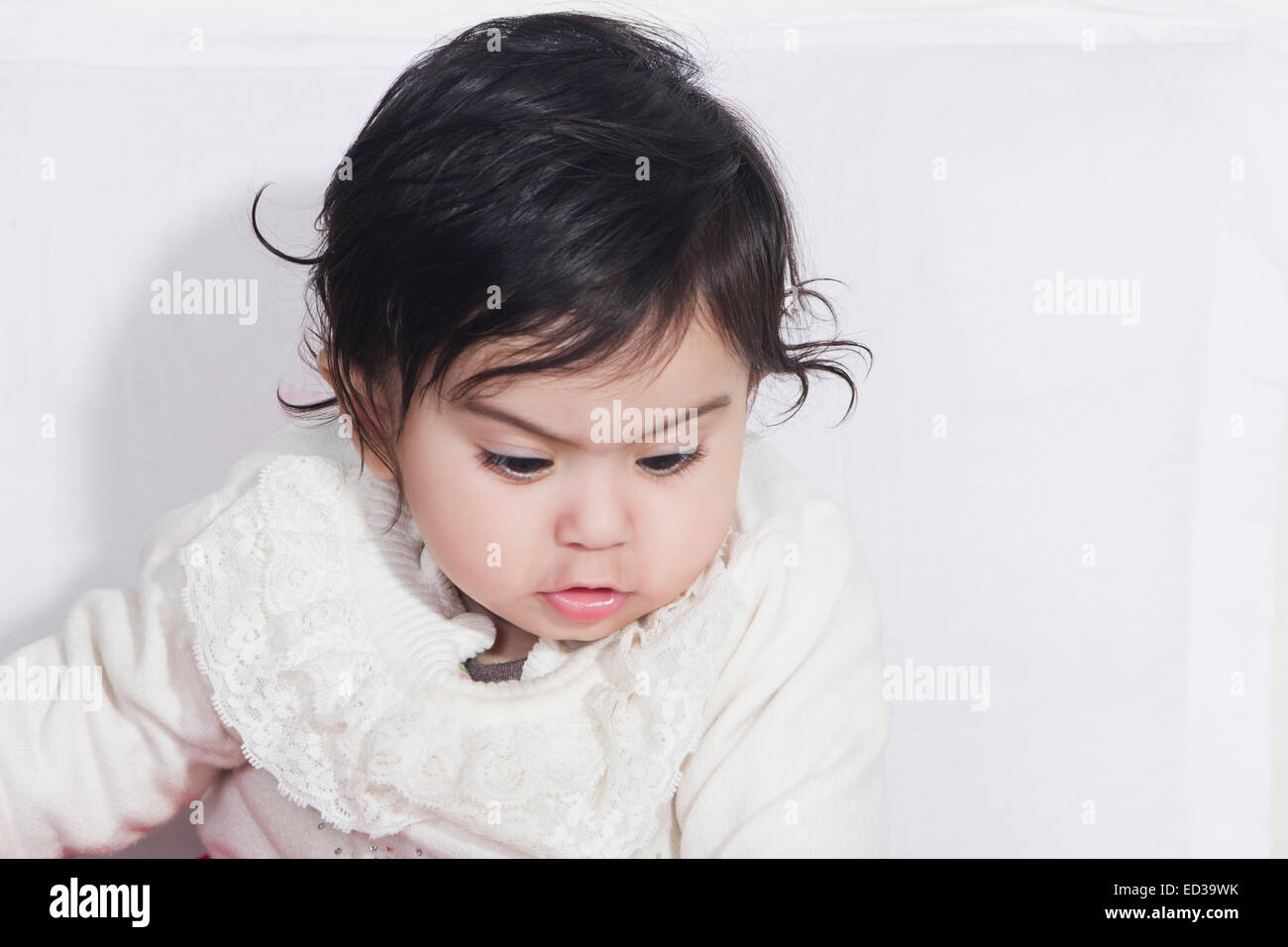 Child sitting on bed india hi-res stock photography and images - Alamy