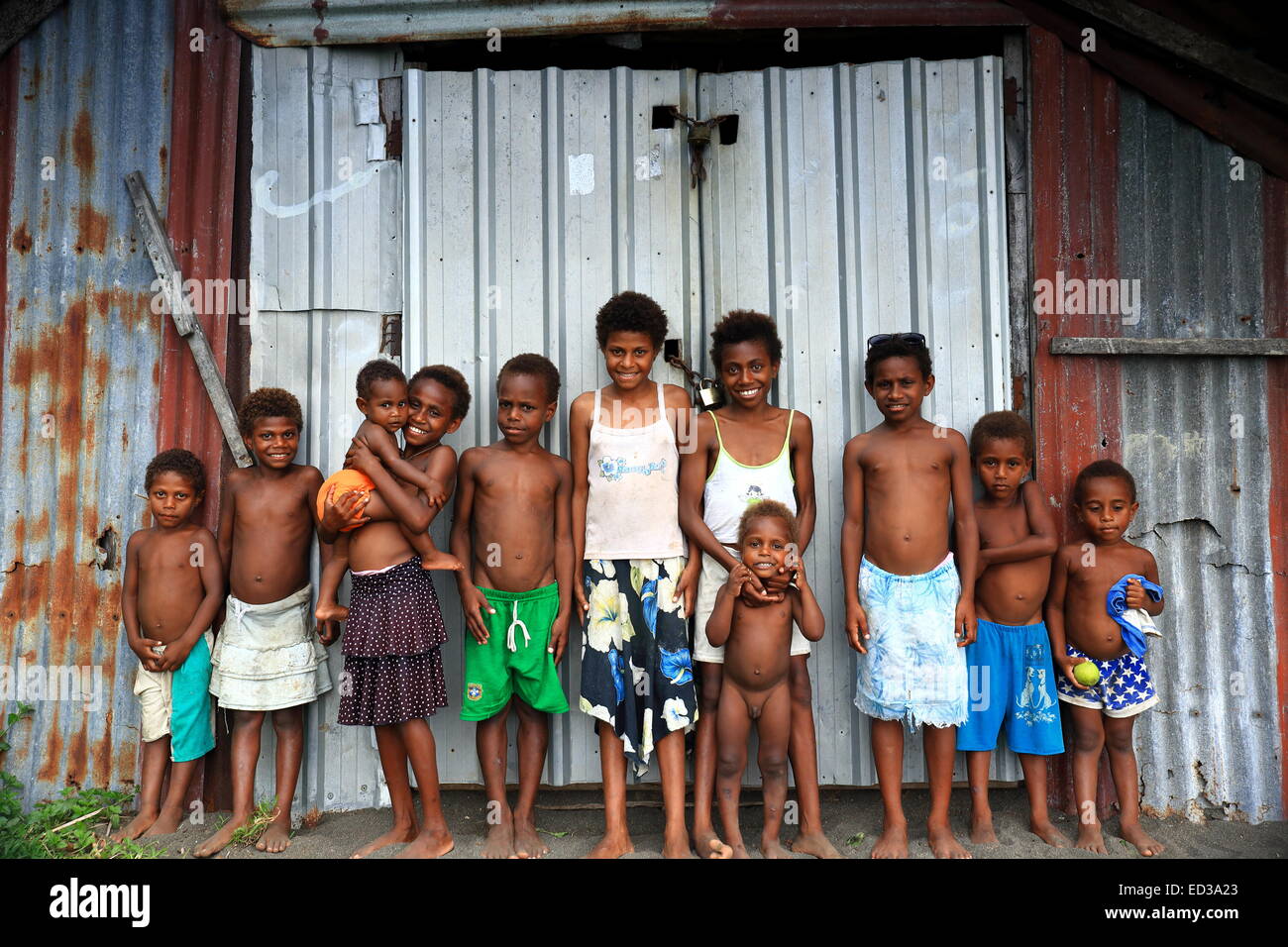 AMBRYM,VANUATU-OCTOBER 10, 2014: Eleven kids pose for the photographer ...
