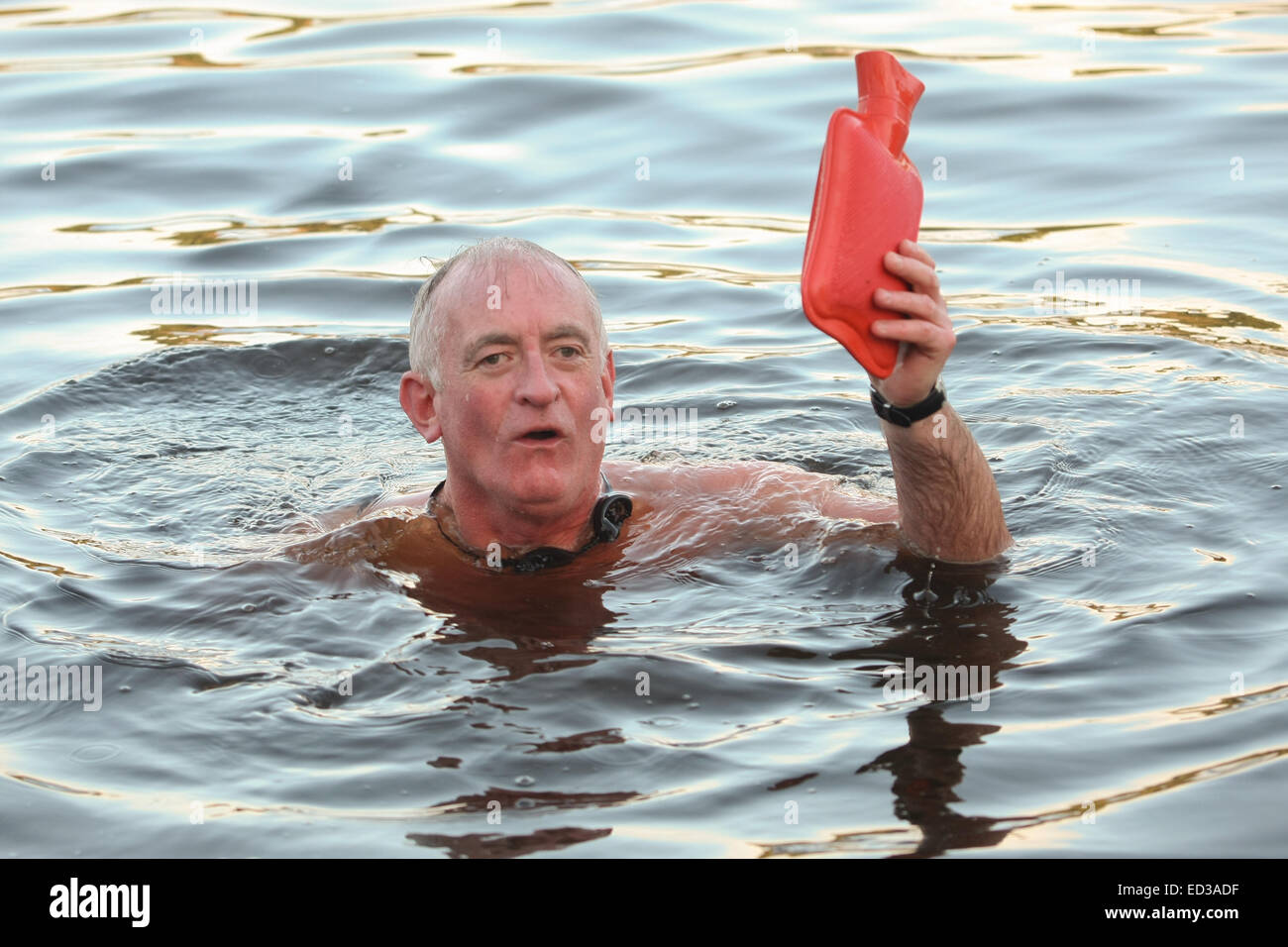 Swimmers in the traditional Christmas Day cold water dip or swim in a ...