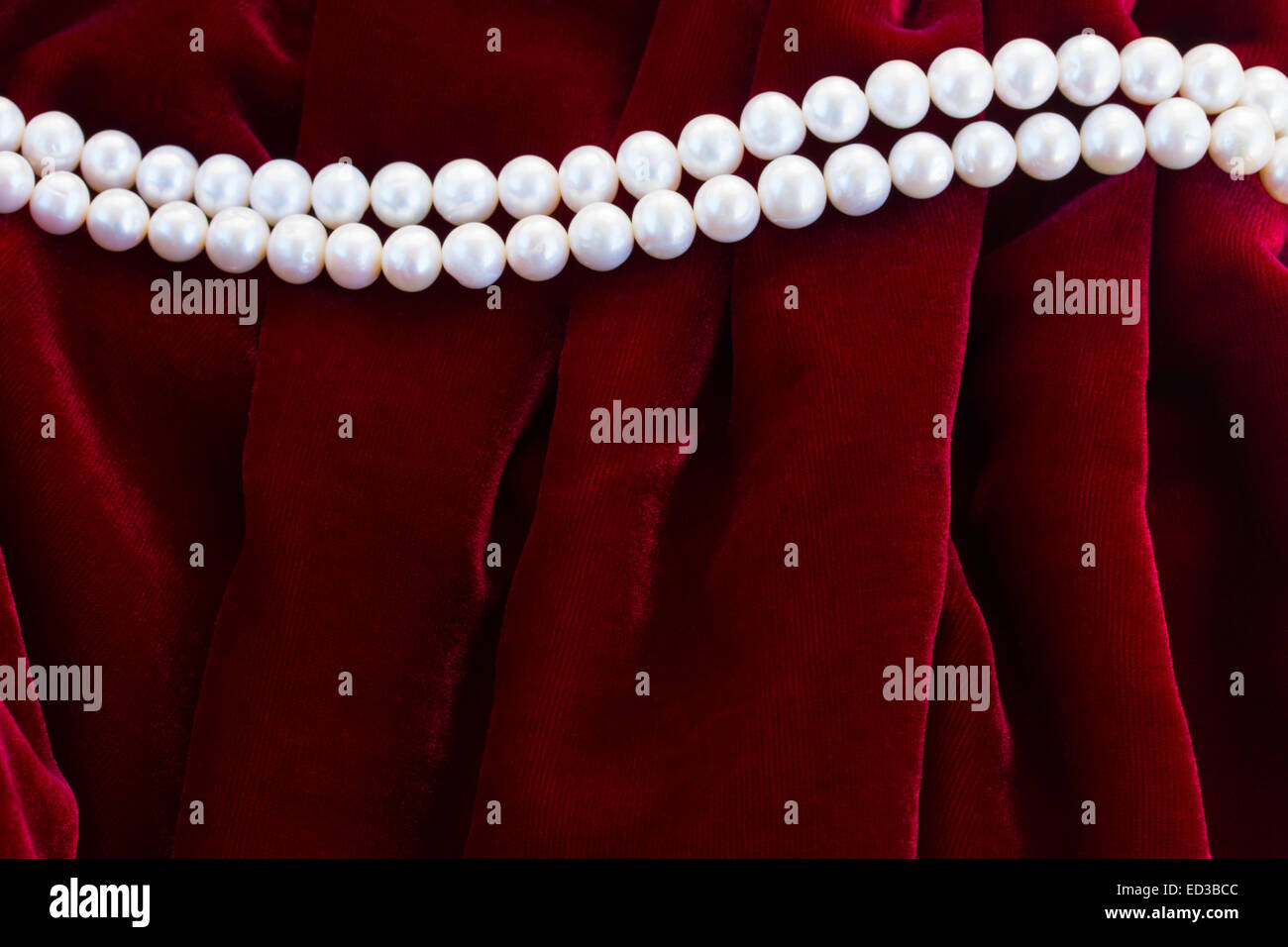 red velvet background with pearls Stock Photo - Alamy