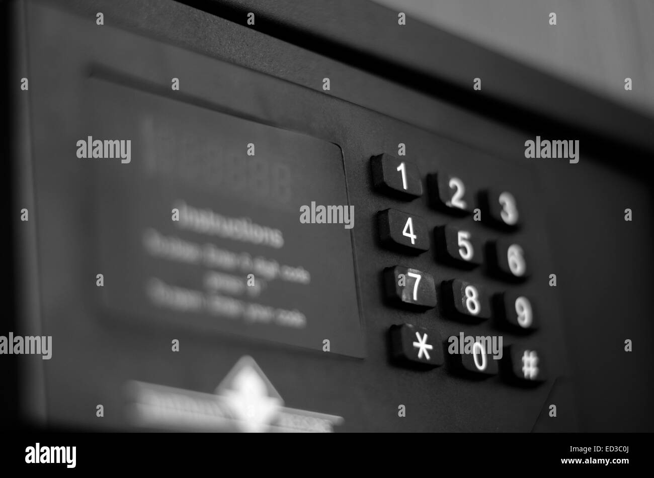 Hotel room black safe's keypad Stock Photo - Alamy
