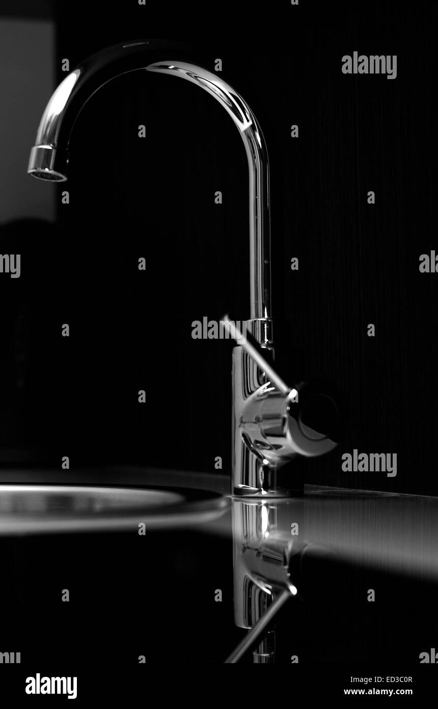 Hotel room kitchen's chrome tap Stock Photo - Alamy
