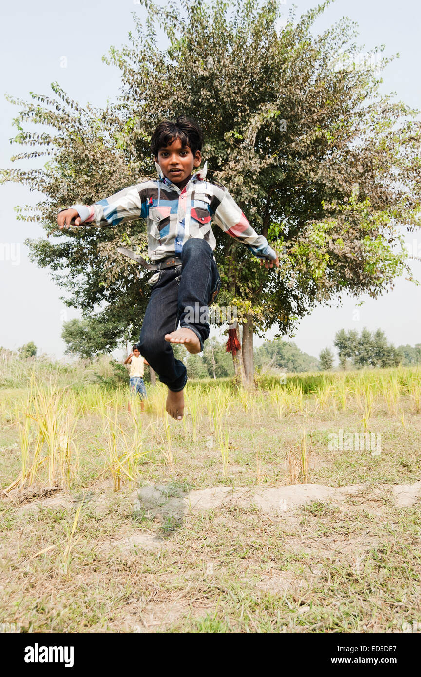 1 indian rural child boy farm Jumping Stock Photo - Alamy