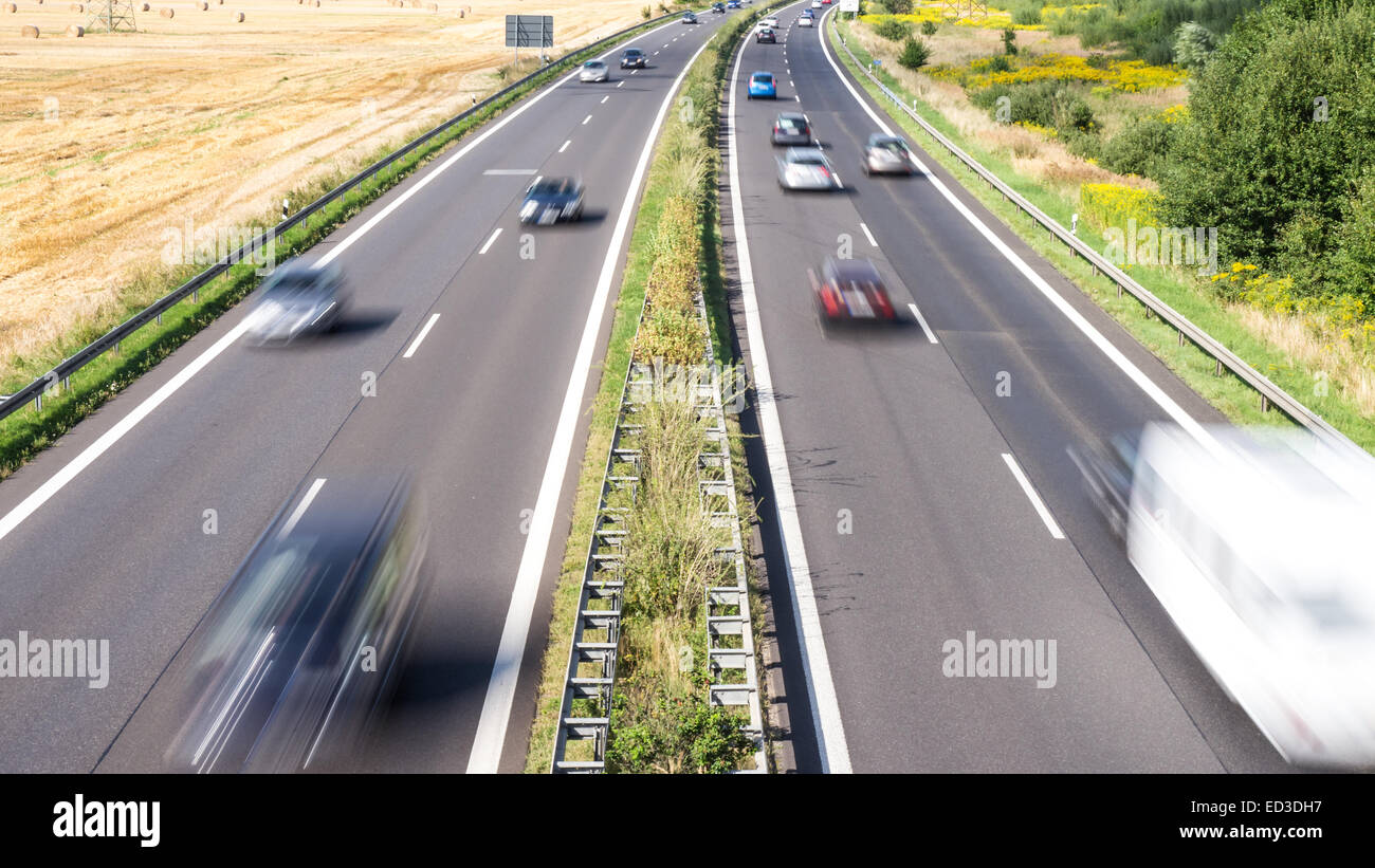highway in landscape in summer and a few cars Stock Photo - Alamy
