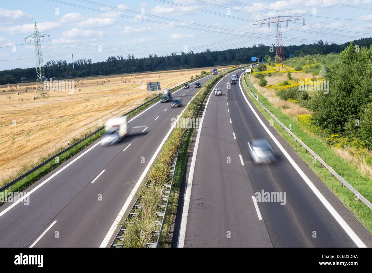 highway in landscape in summer and a few cars Stock Photo - Alamy