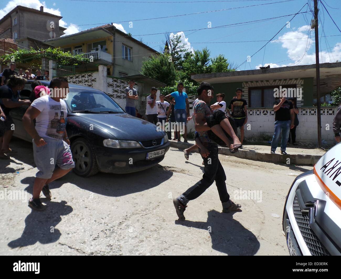 People and rescue workers search for survivers and try to clean homes ...