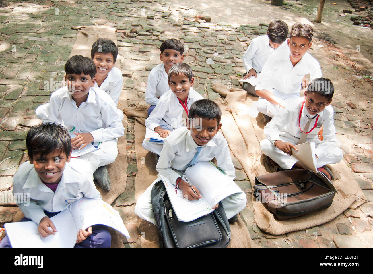 Boys studying outside classroom hi-res stock photography and images - Alamy