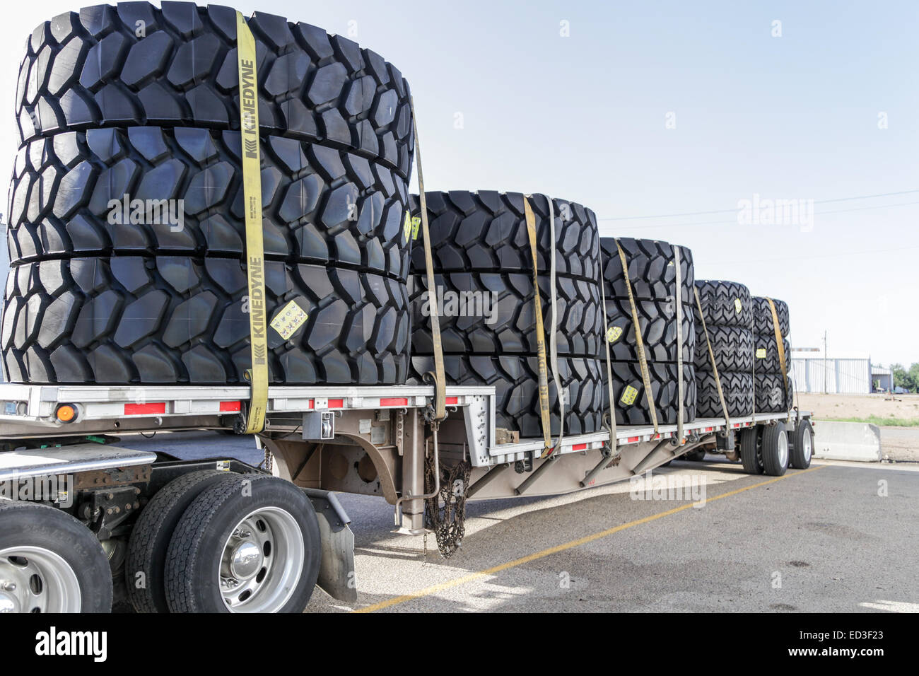 Peterbilt truck with load of large mining tyres on flatdeck trailer ...