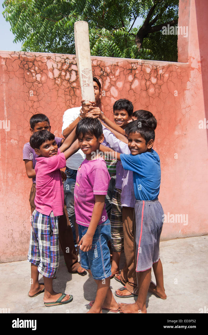indian rural group children boys Playing cricket Stock Photo - Alamy