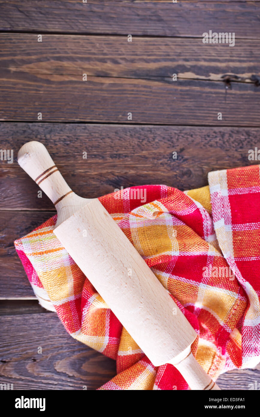 wooden rolling pin and napkin on a table Stock Photo - Alamy