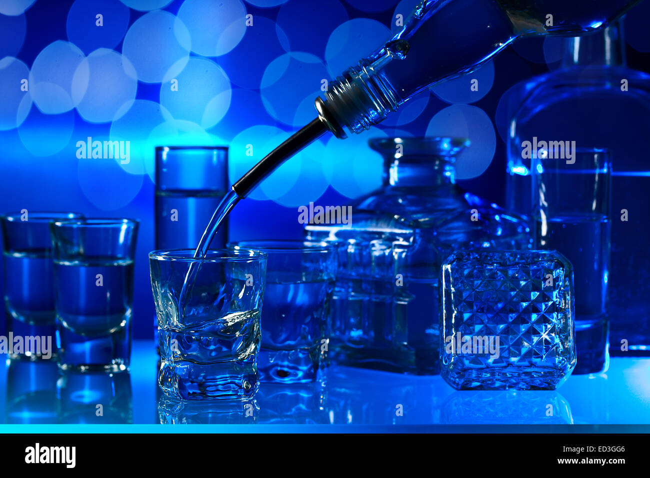 vodka in bar on a glass table Stock Photo - Alamy