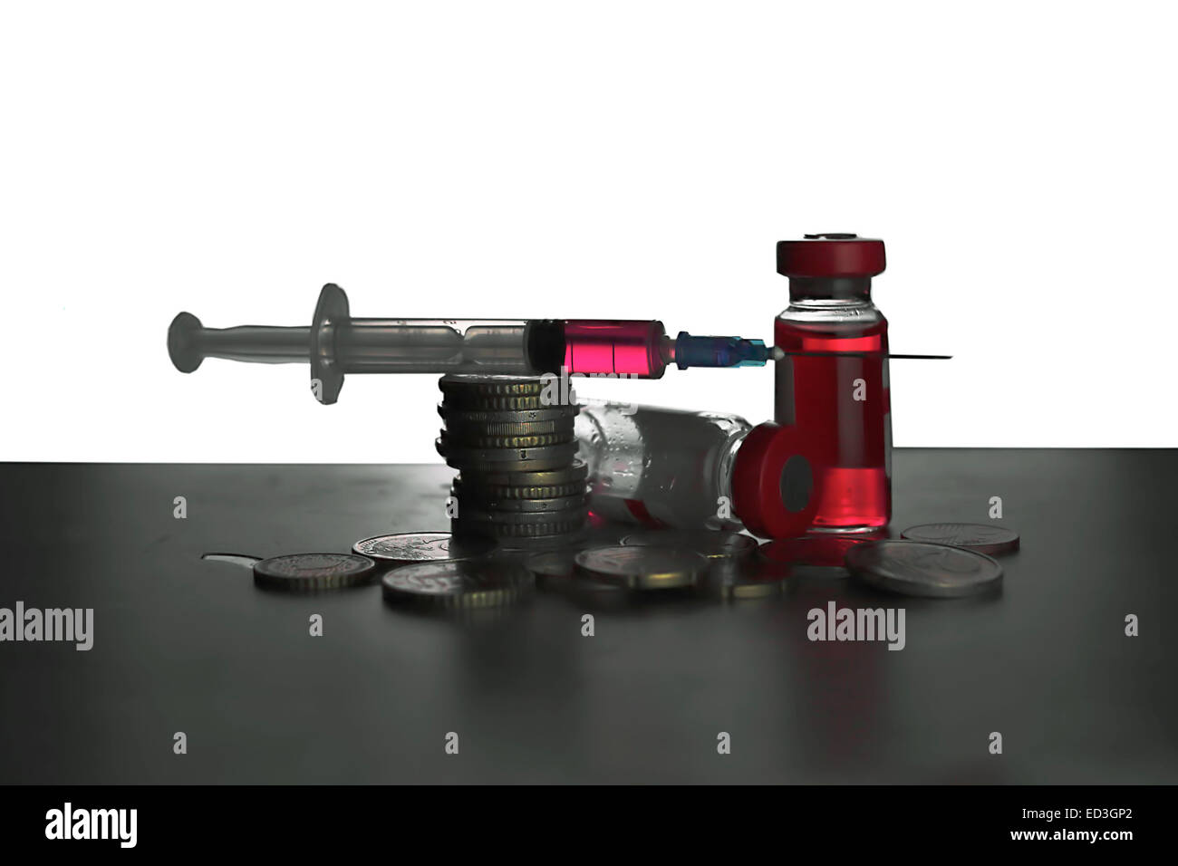 Syringe, Coins and Vials Stock Photo - Alamy