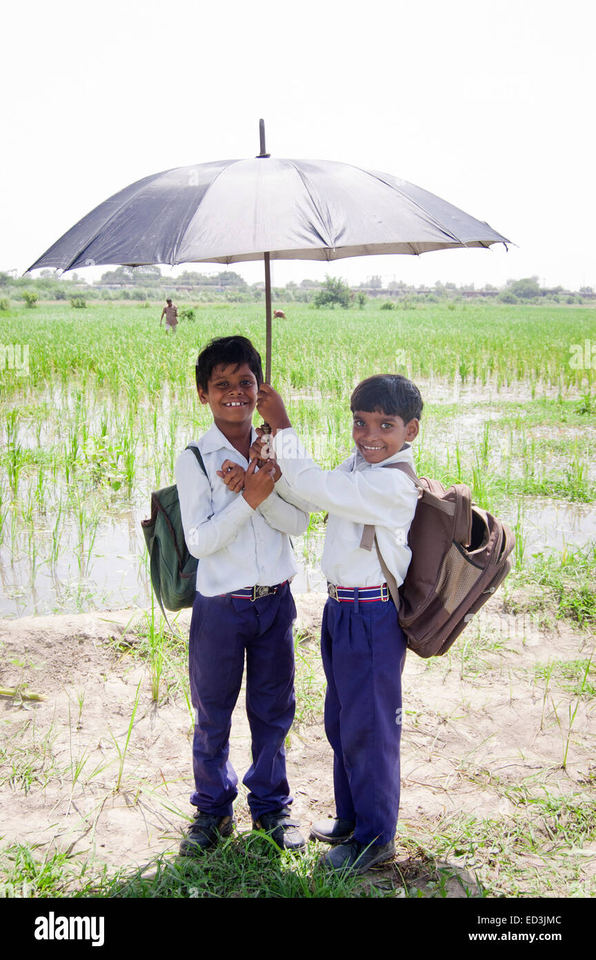 Child With Umbrella In Rain