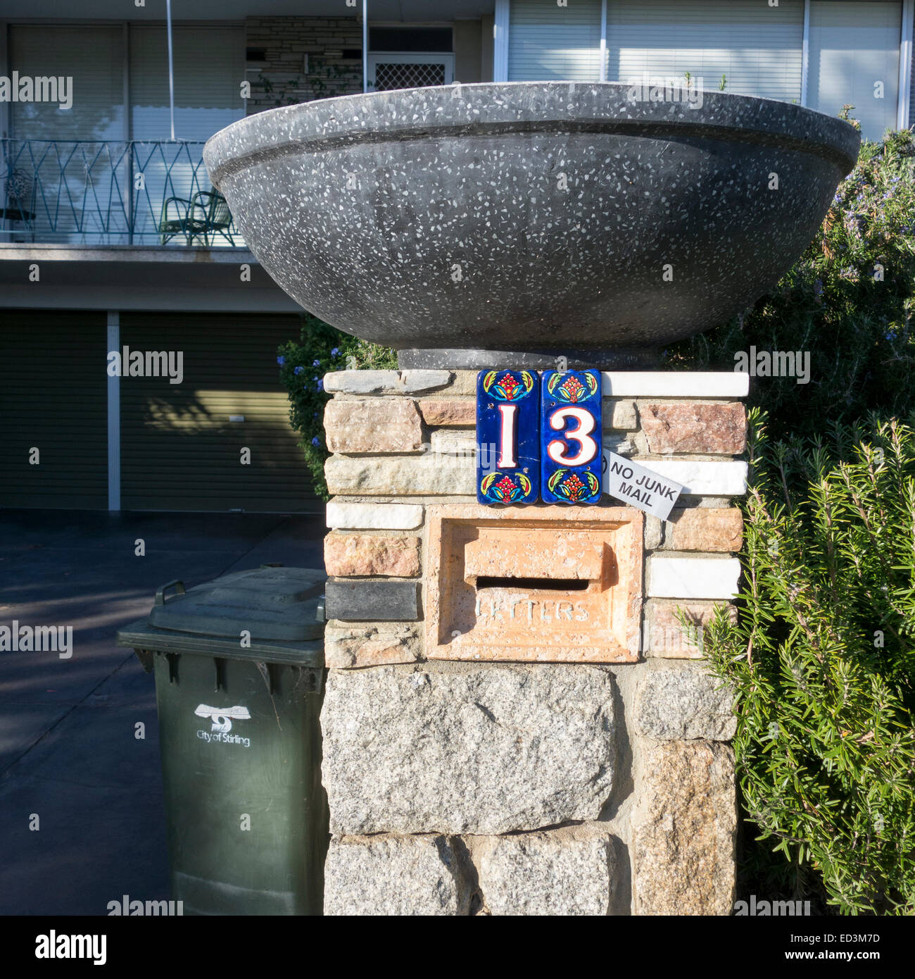 Letter Box with pottered plant pot Stock Photo - Alamy