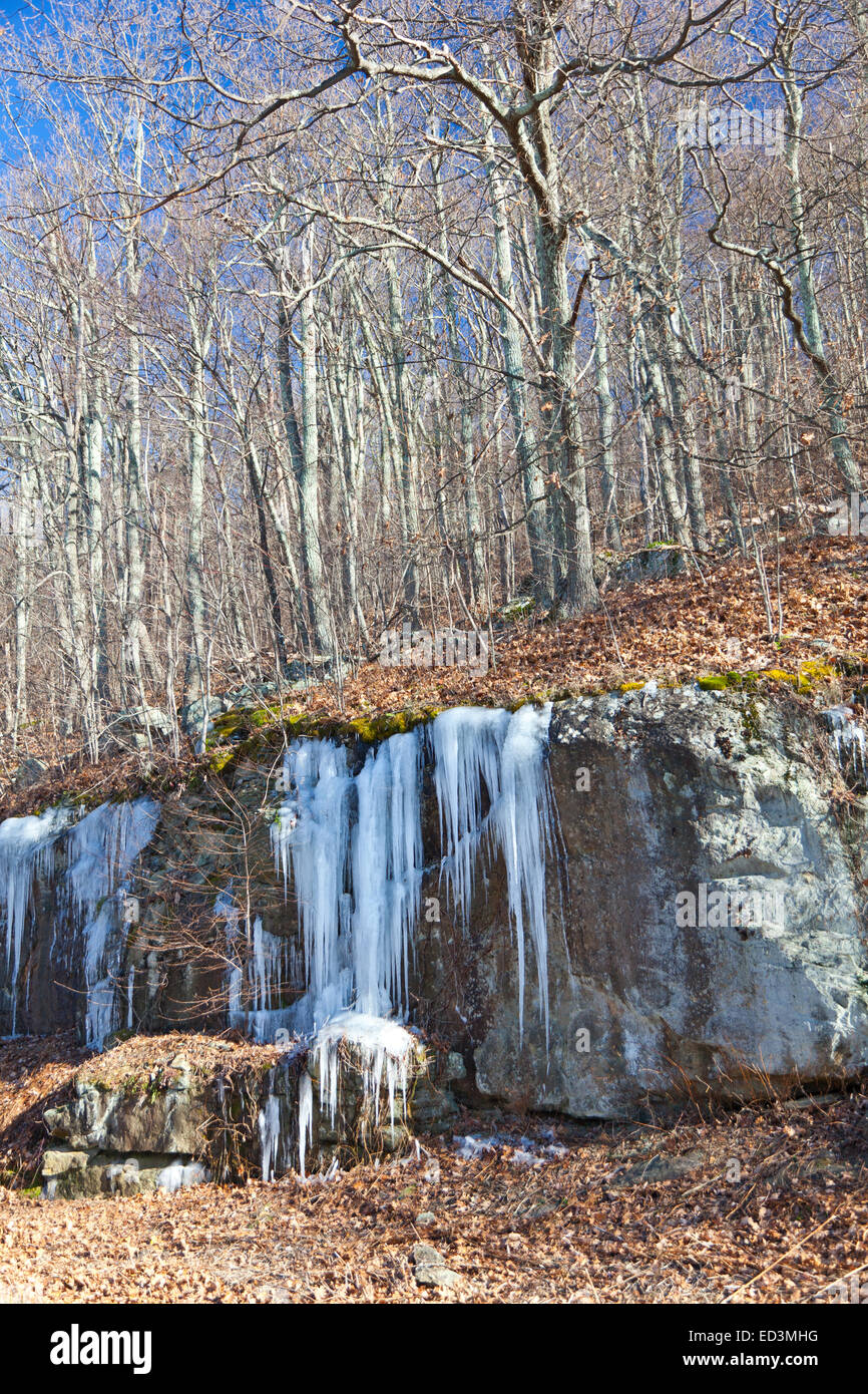 Long icicles forming on a hillside by the side of a road Stock Photo ...