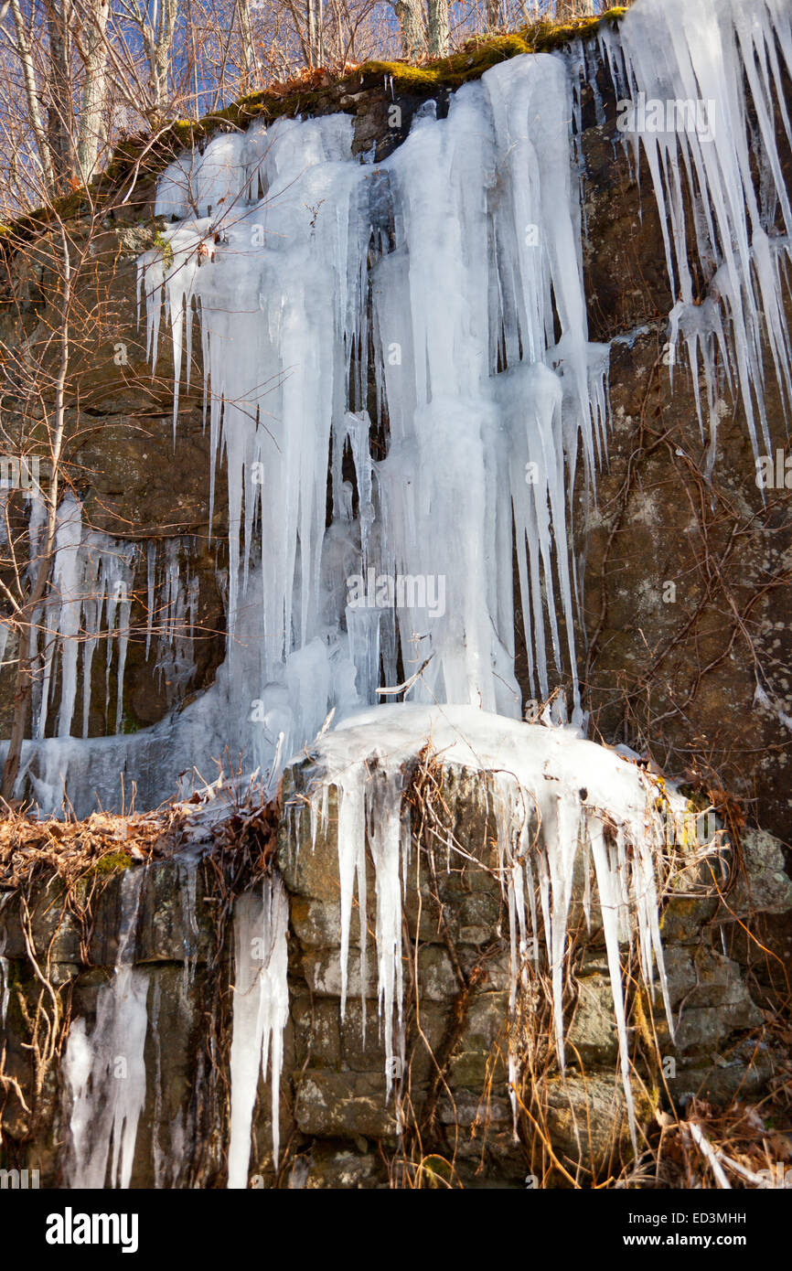 Long icicles forming on a hillside by the side of a road Stock Photo ...