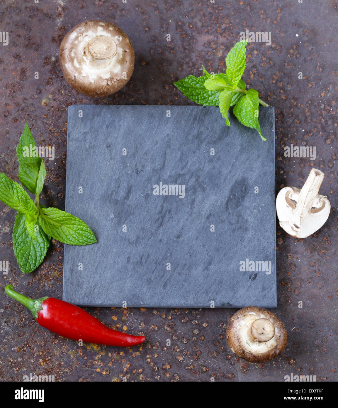 Food background on slate with herbs and vegetables Stock Photo - Alamy