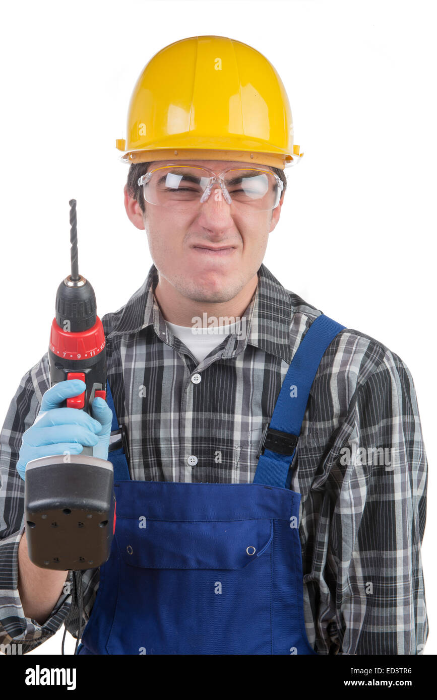 young worker with a drill is angry on the white background Stock Photo ...