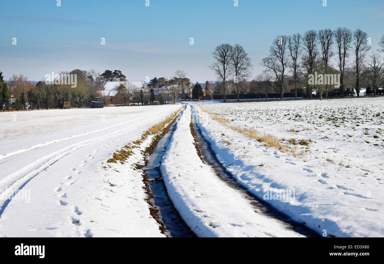 English Winter Rural Landscape with track through a snow covered field ...