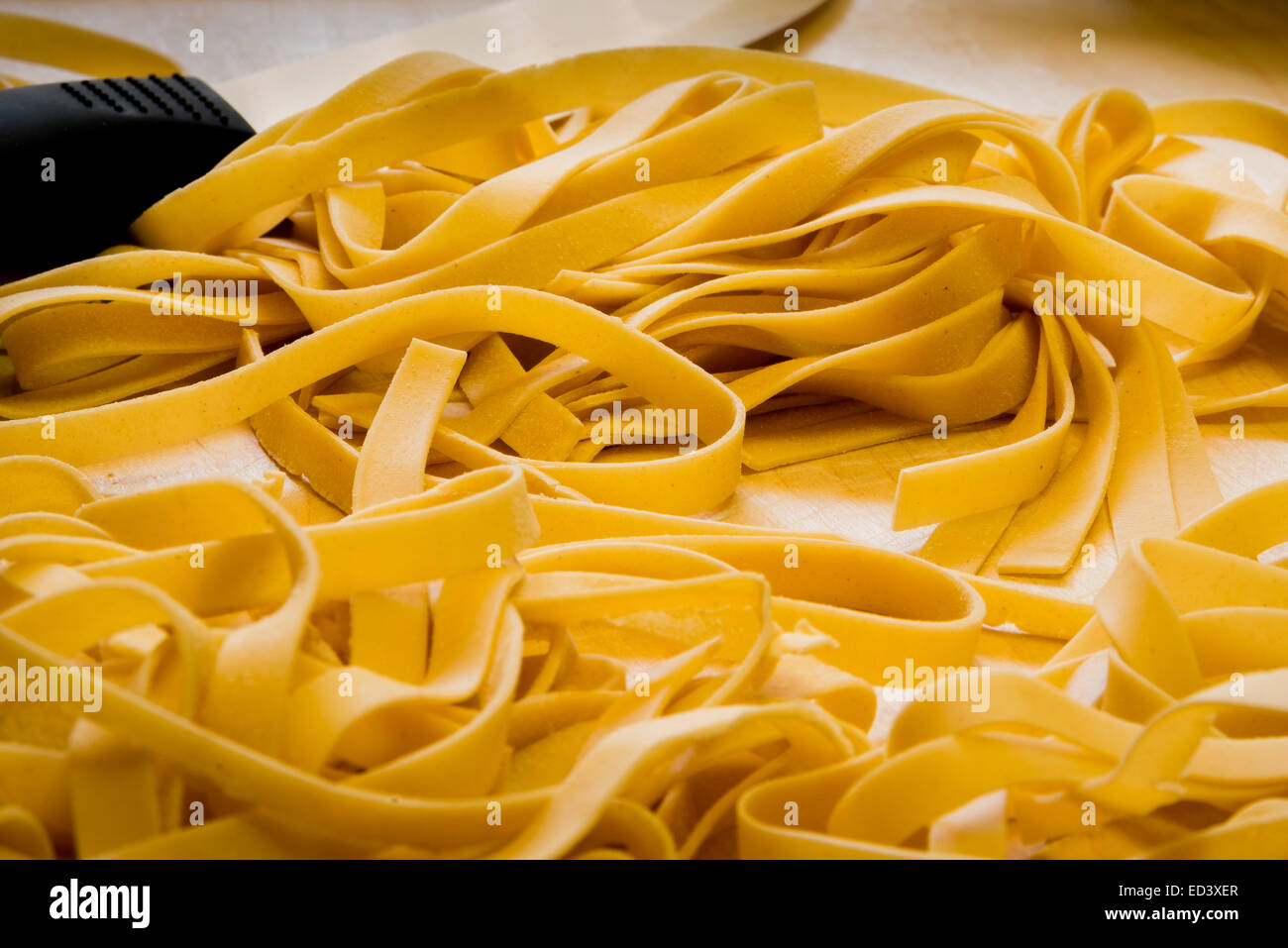 Fettuccine or tagliatelle cut ready to cook Stock Photo - Alamy