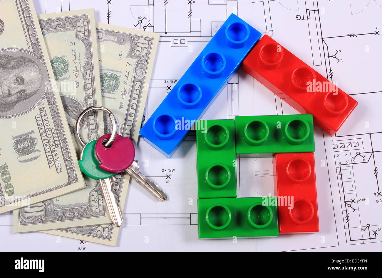 House shape of colorful building blocks, home keys and banknotes on ...