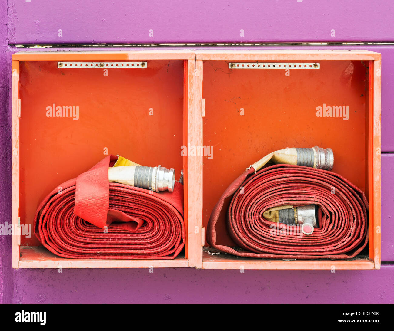 Old red fire hose reel hi-res stock photography and images - Alamy