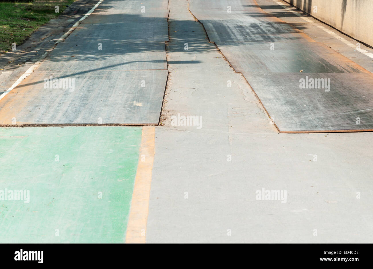 Metal sheet on the urban street near the construction site Stock Photo ...