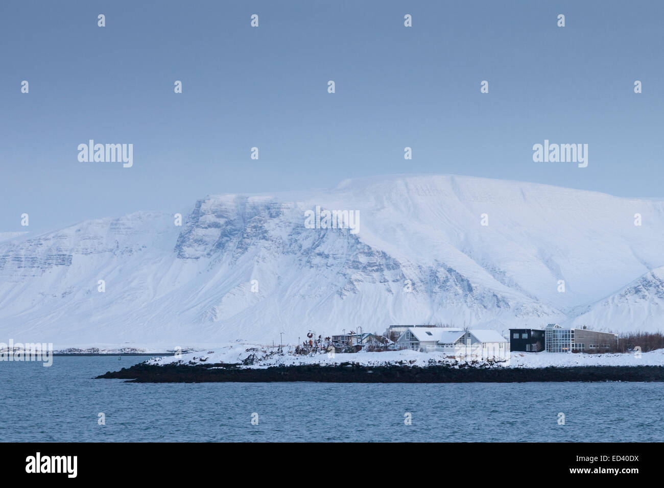 Videy Island covered with snow, view from Reykjavik Stock Photo - Alamy