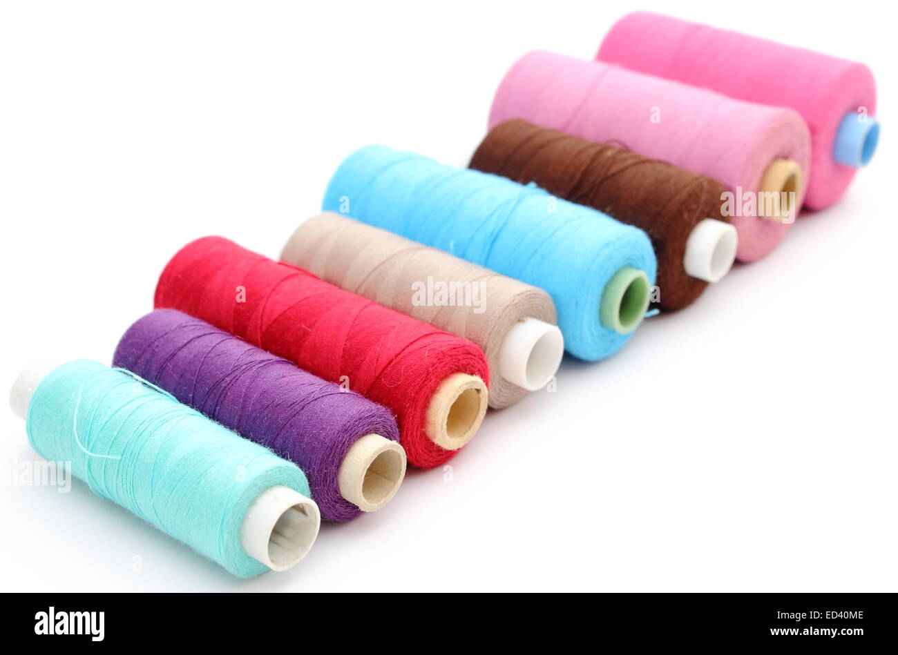 Colorful spools of thread isolated on white background Stock Photo - Alamy