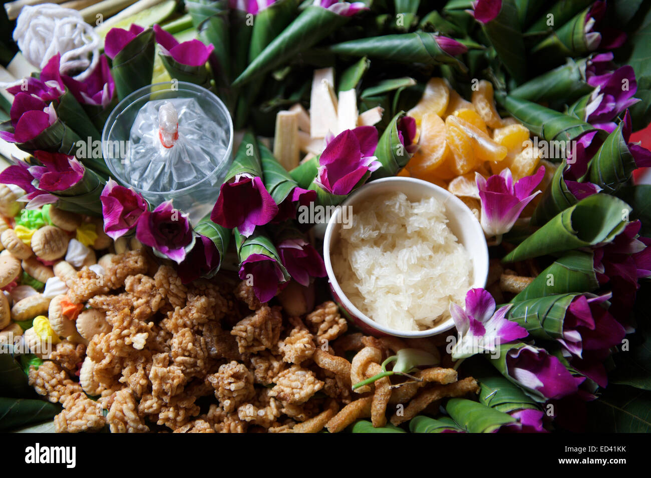 Flowers and fruits offerings at Buddhist Thai temple Stock Photo - Alamy