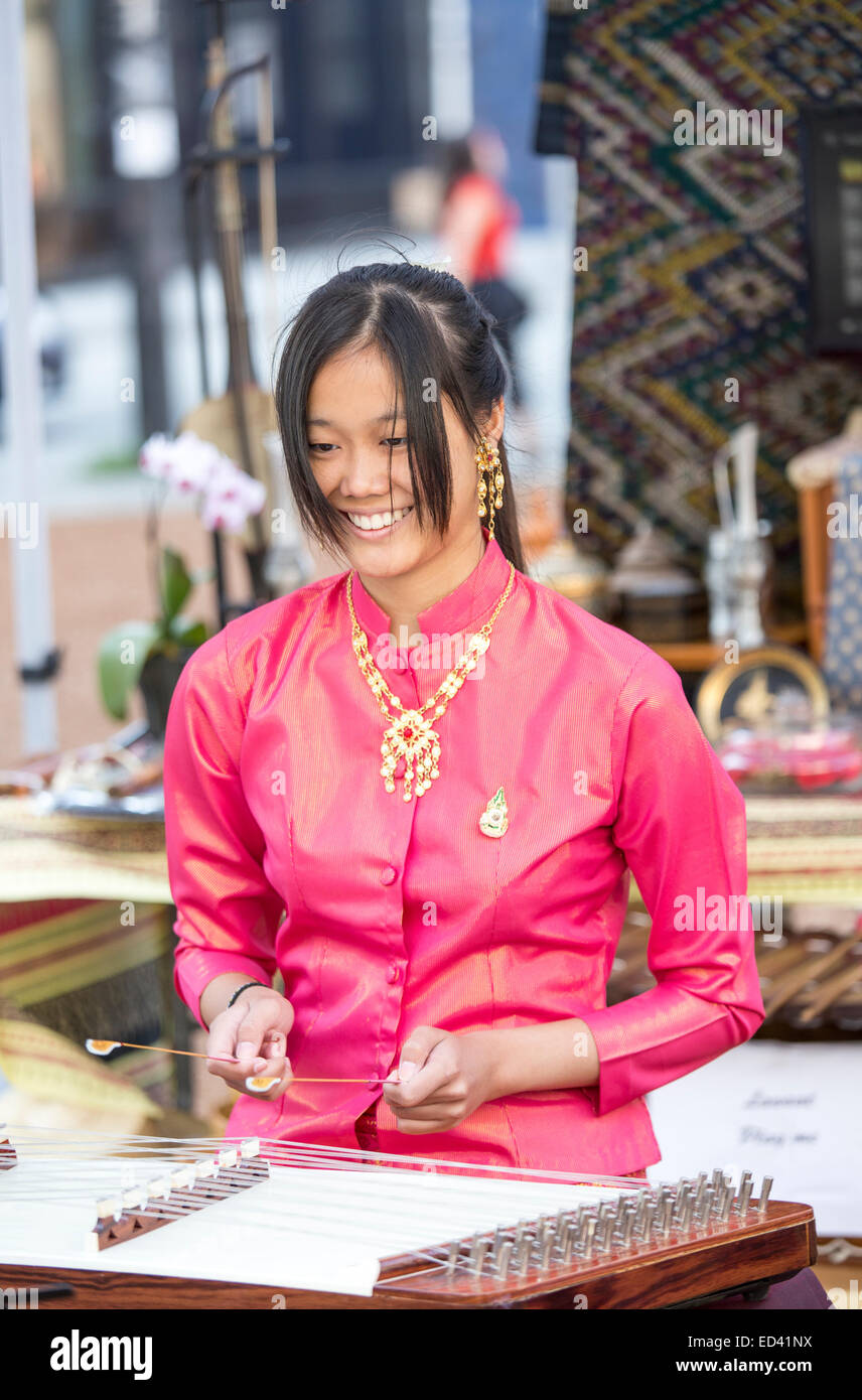 Thai woman playing khim, a hammered dulcimer Stock Photo - Alamy