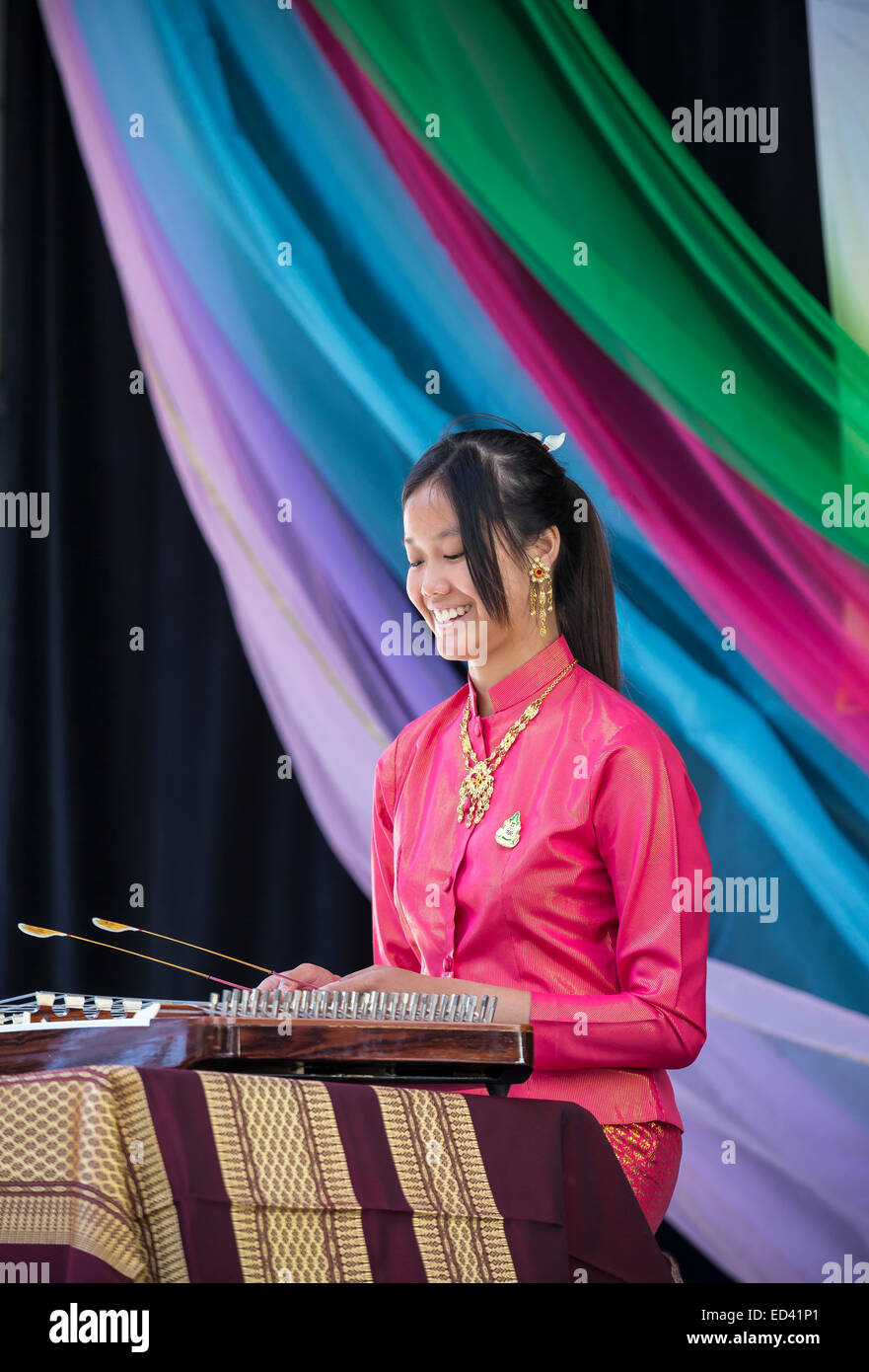 Thai woman playing khim, a hammered dulcimer Stock Photo - Alamy
