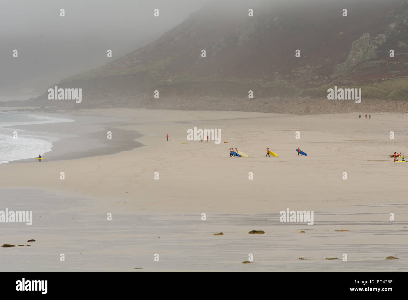 Learning to surf at surf school on beach at Sennen Cove, Cornwall ...