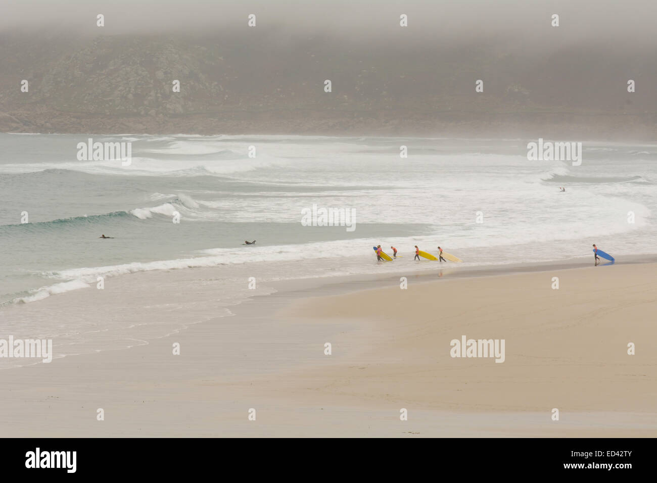 Learning to surf at surf school on beach at Sennen Cove, Cornwall ...