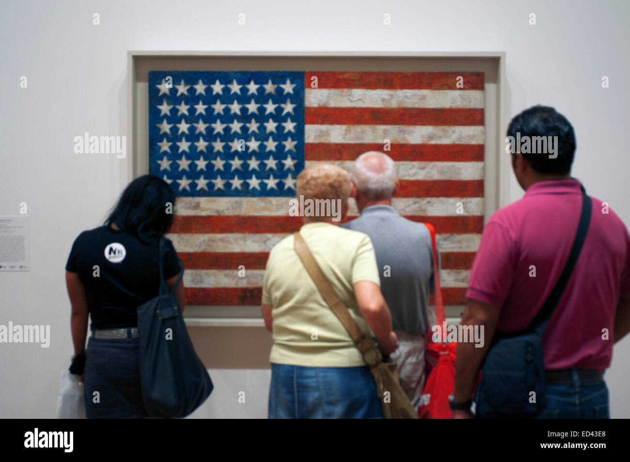 MOMA Museum. Museum goers contemplate ":American Flag" by the artist ...