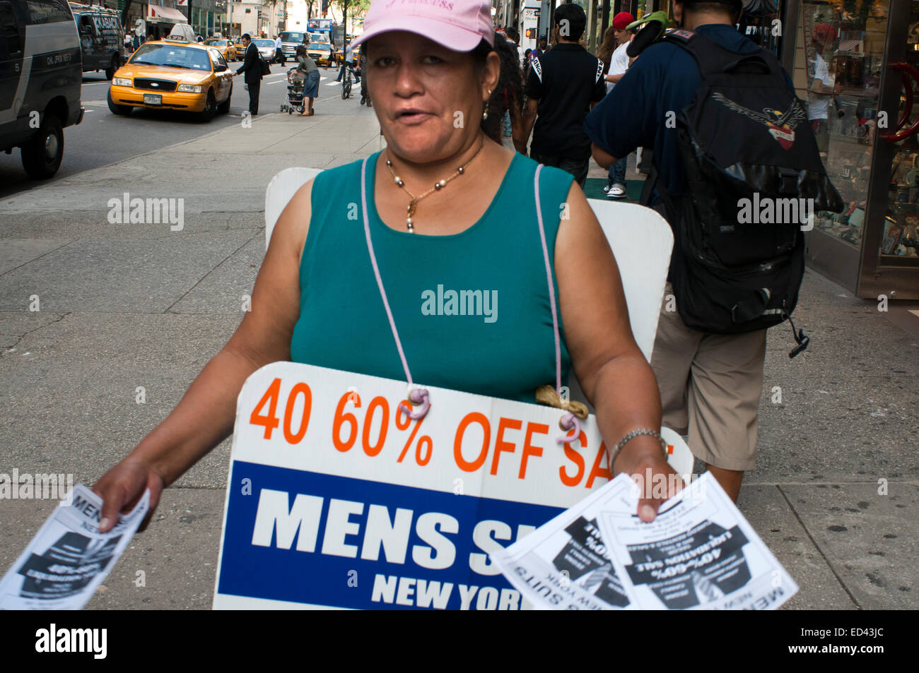 WOMAN WEARING SANDWICH BOARD ADVERTISING PENNY RESTAURANT. A human ...