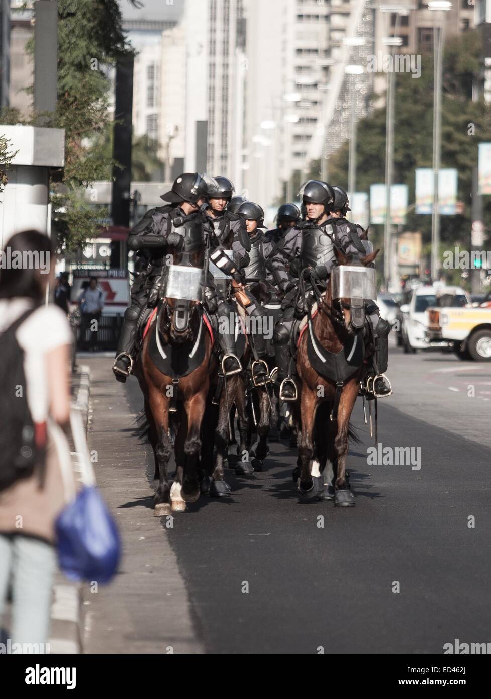 Armed riot police patrol the streets of Sao Paulo during the 2014 FIFA ...