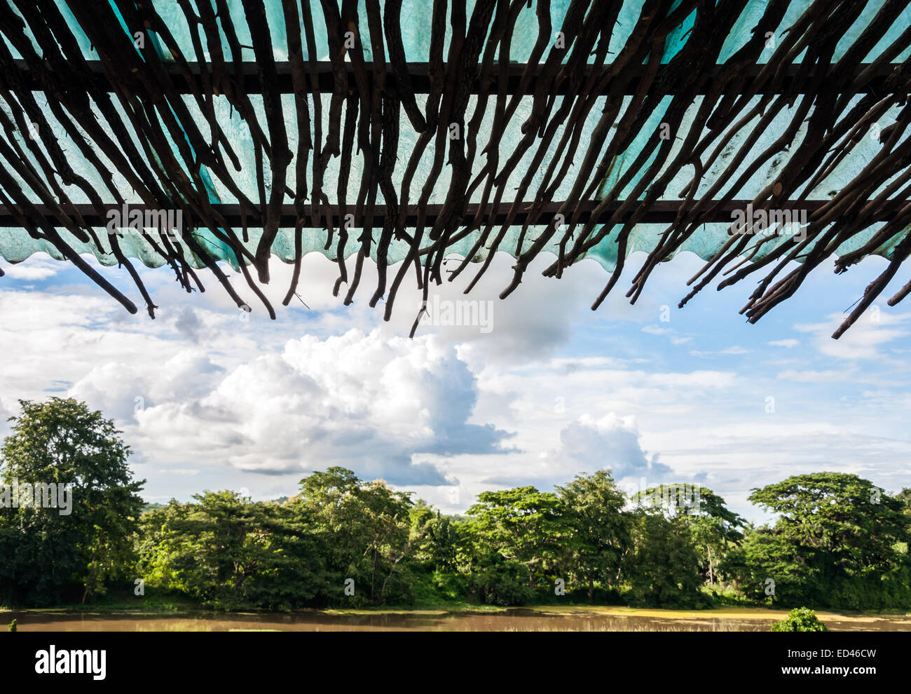 Tropical view from wooden eaves of small cottage Stock Photo - Alamy