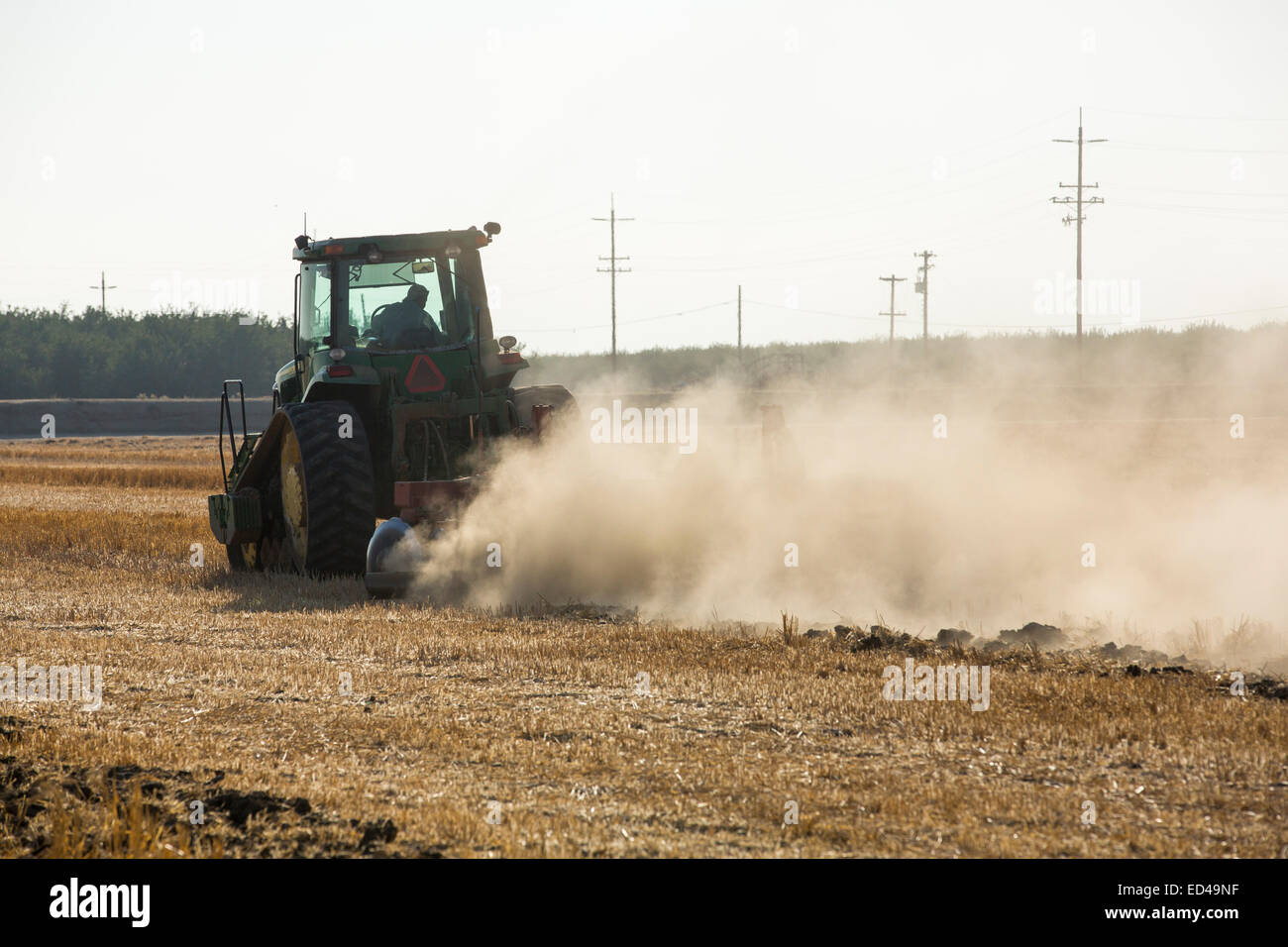 Dust blows from a farmers field as it is ploughed as a result of the ...