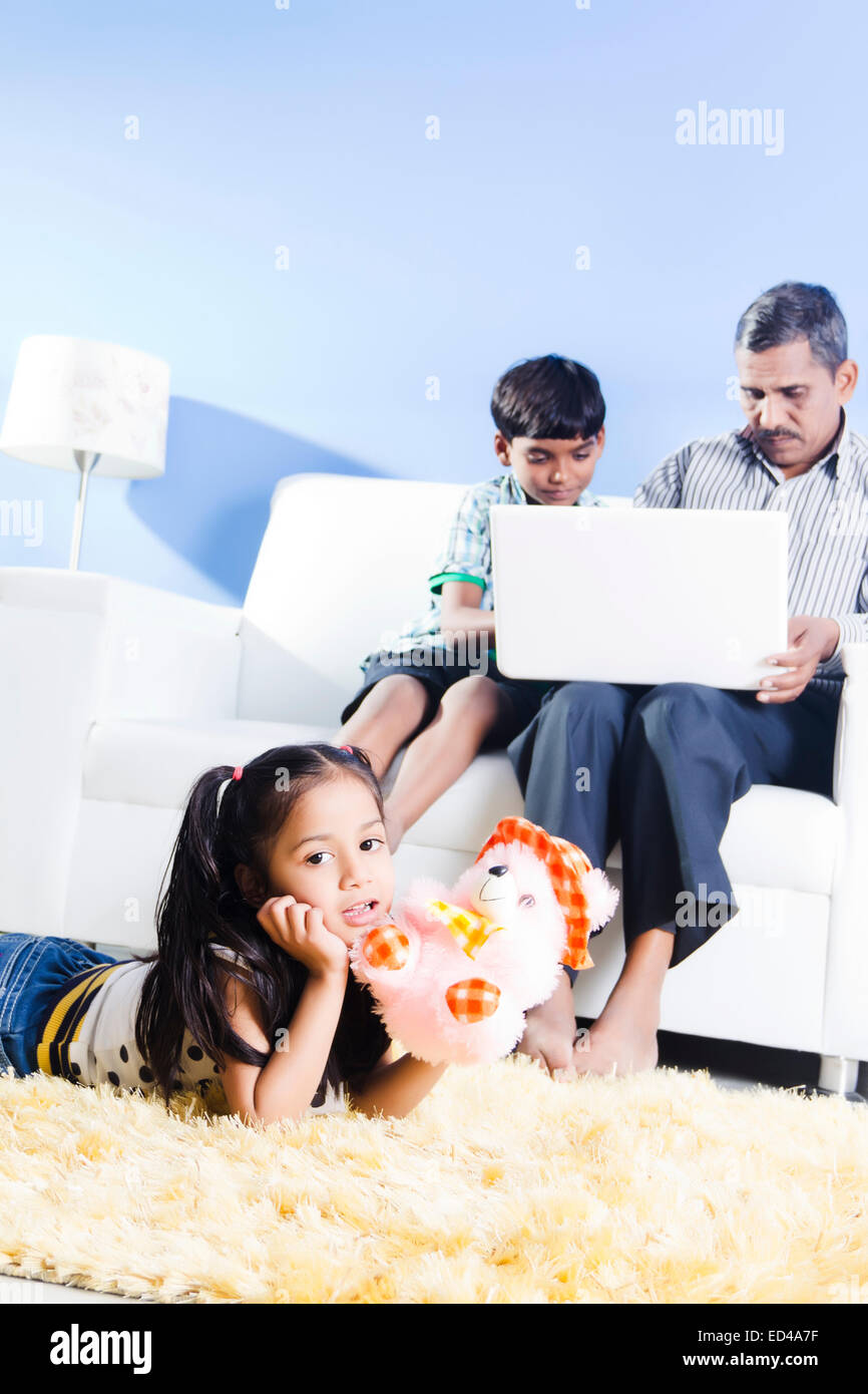 indian father with children laptop watching Stock Photo - Alamy